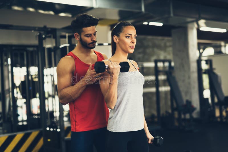 Personal Trainer Instructing Trainee Stock Image - Image of exercising ...