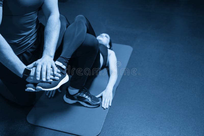 Personal Trainer Man Working with Young Woman in Modern Gym Stock Photo ...