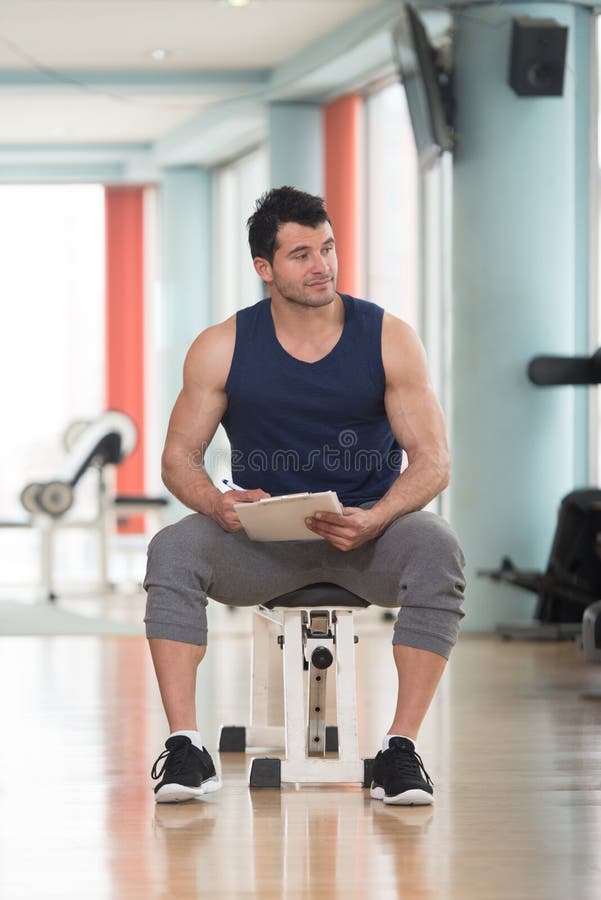 Handsome Personal Trainer with a Clipboard Stock Photo - Image of ...