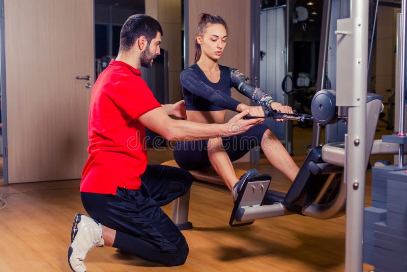 Personal Trainer Working with His Client in Gym Stock Photo - Image of ...