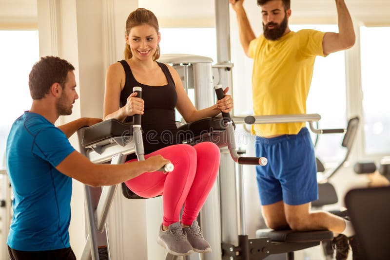 Personal Trainer Working with His Client in Gym Stock Photo - Image of ...