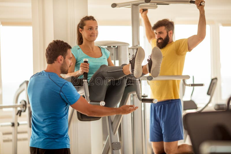 Personal Trainer Working with His Client in Gym Stock Image - Image of ...