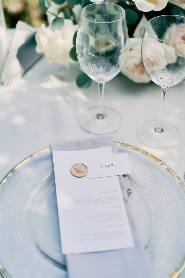 Personalized Invitation is Attached To a Festive Menu on a Plate on the ...