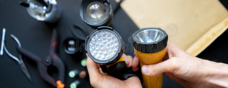 Persons Hands Hold a Flashlight in a Workshop B Stock Image - Image of ...