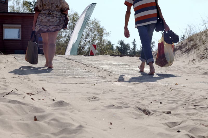 Persons Walk on the Beach Sand Stock Photo - Image of barefoot, girl ...