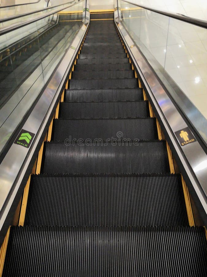Perspective of escalator stock photo. Image of signage - 136840864