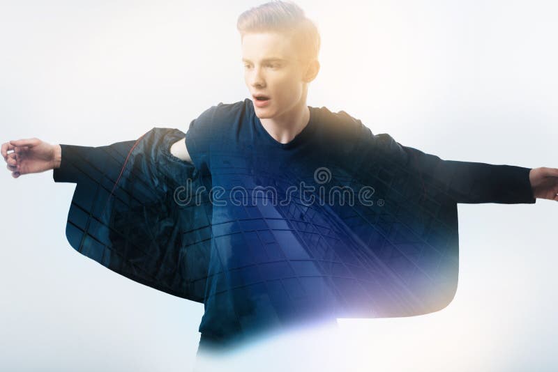 Perspective Handsome Model Standing and Putting Off His Jacket. Stock ...