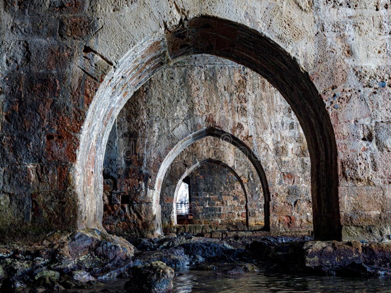 Perspective of the Old Shipyard Tersane through Stone Arches in Turkish ...