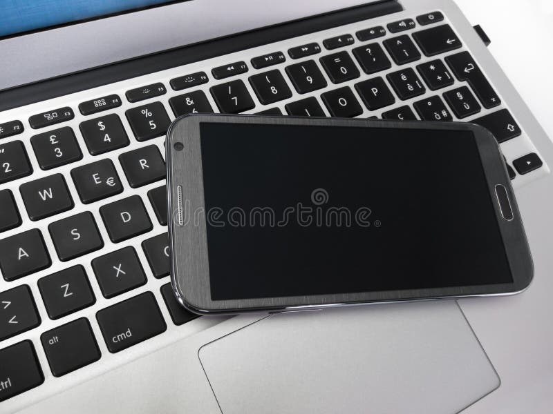 Phablet on laptop stock photo. Image of bluetooth, close - 30241456