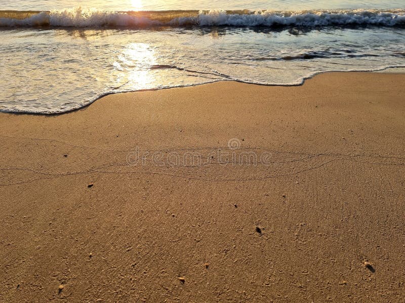 The Perspective of the Sea Waves Hitting the Sand of the Beach Stock ...