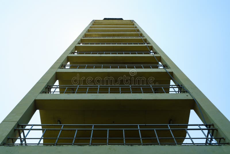 Perspective Upwards of a Building with a Fence Stock Image - Image of ...