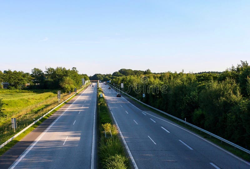 Perspective View of Autobahn in with Trees and Clear Blue Sky ...