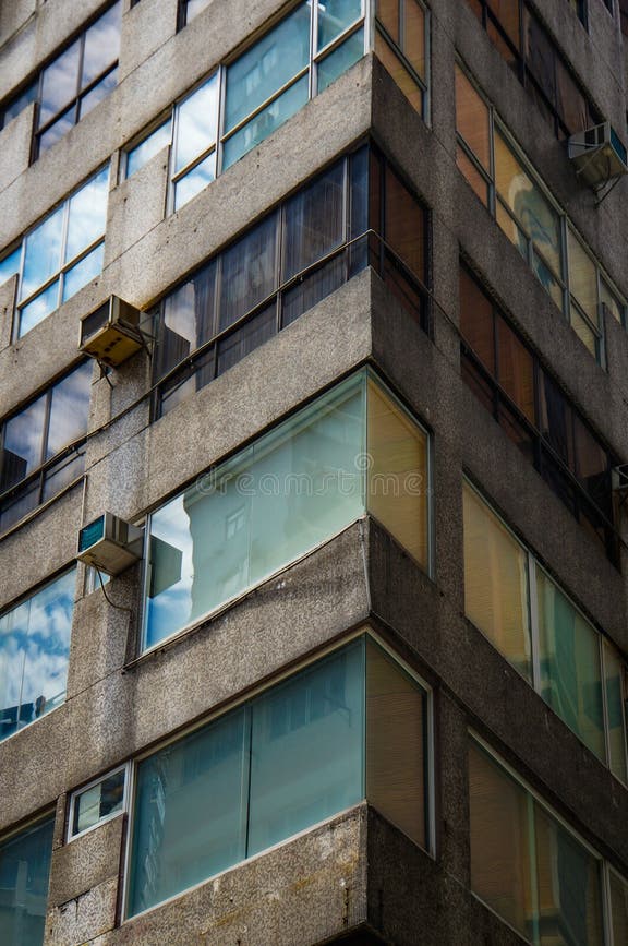 Perspective View of Brown Commercial Building with Windows Lining the ...