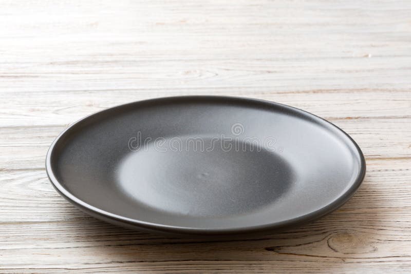 Perspective View of Empty Black Plate on Wooden Background. Empty Space ...