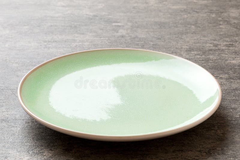 Perspective View of Empty Green Plate on Cement Background. Empty Space ...