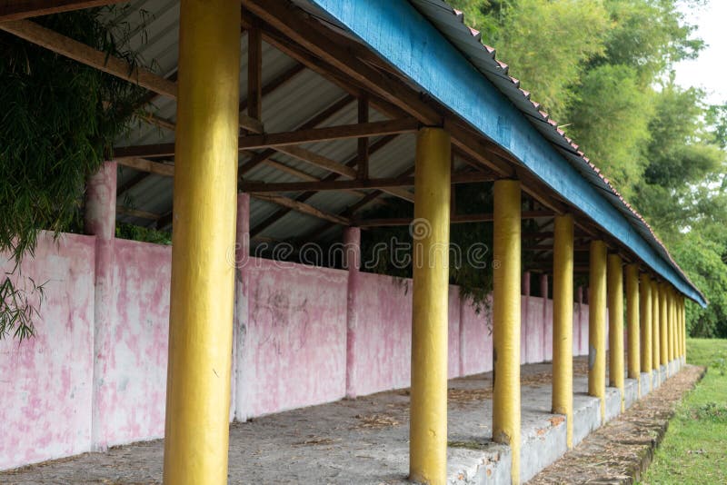 Perspective View of an Empty Small Building with a Wall and Some Yellow ...