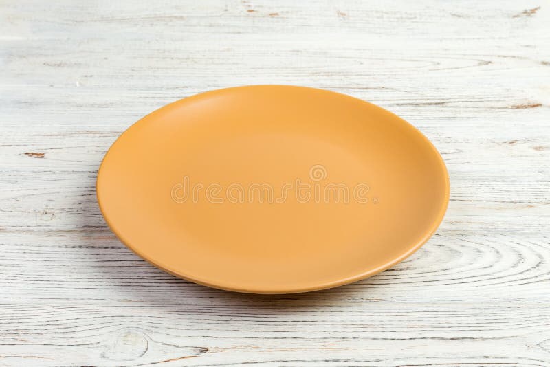 Perspective View. Empty Yellow Matte Plate on White Wooden Background ...