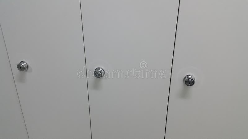 Perspective View of Lockers or Cupboards in a Row with White Doors ...