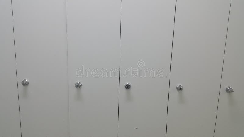 Perspective View of Lockers or Cupboards in a Row with White Doors ...