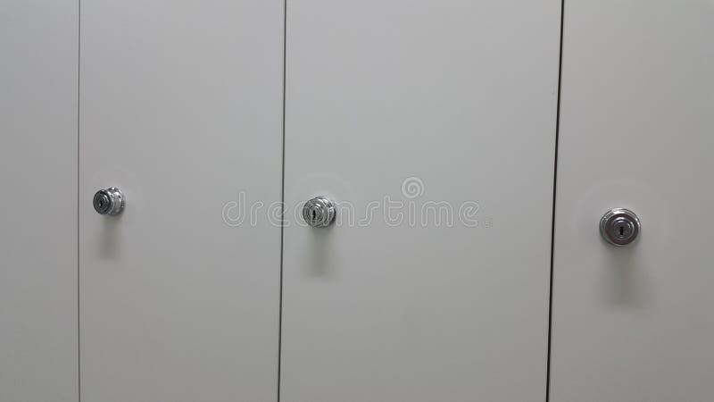 Perspective View of Lockers or Cupboards in a Row with White Doors ...