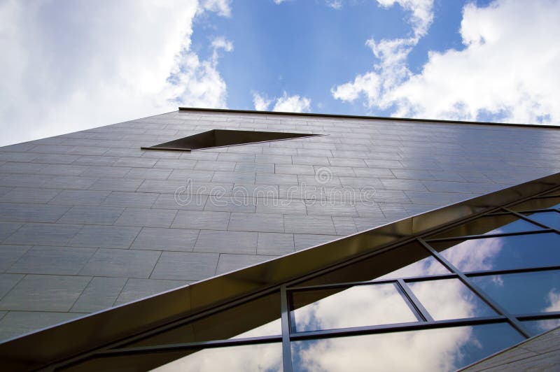 Perspective View of the Modern Building Facade with Clouds Reflections ...