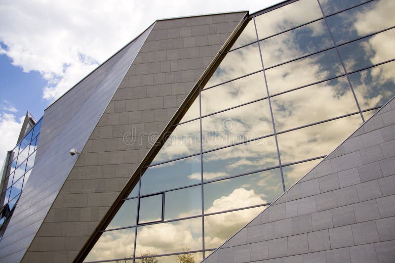 Perspective View of the Modern Building Facade with Clouds Reflections ...