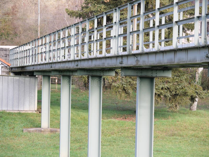 Perspective View of a Pedestrian Bridge with Steel Railing and Grating ...