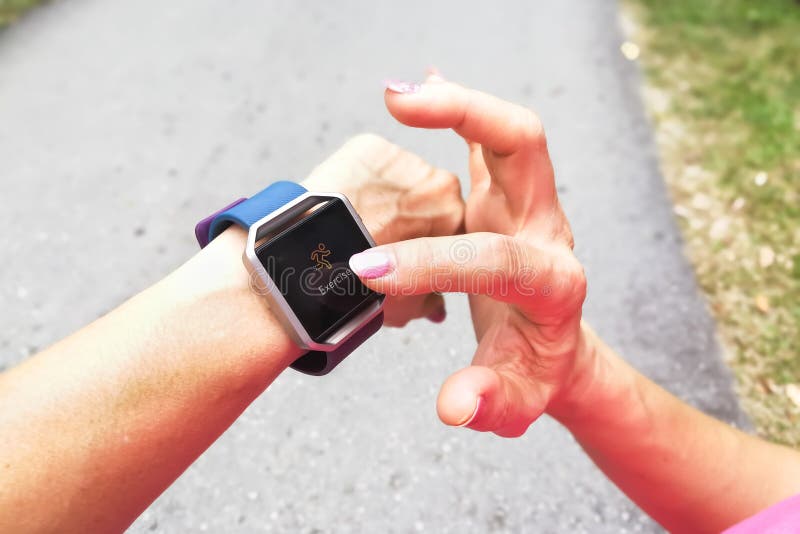 Perspective View Person Reading Watch with Steps and Heart Tracker ...