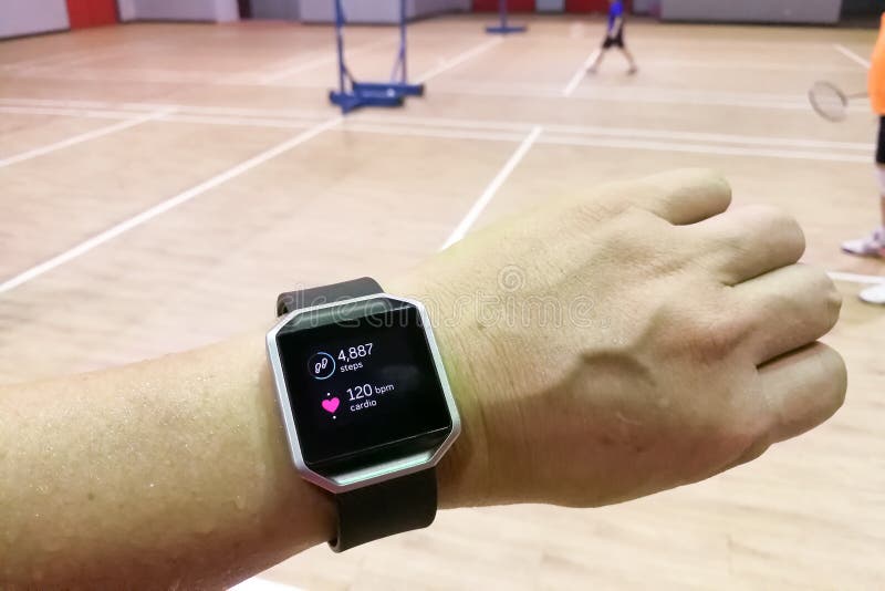 Perspective View Person Reading Watch with Heart Tracker during Stock ...