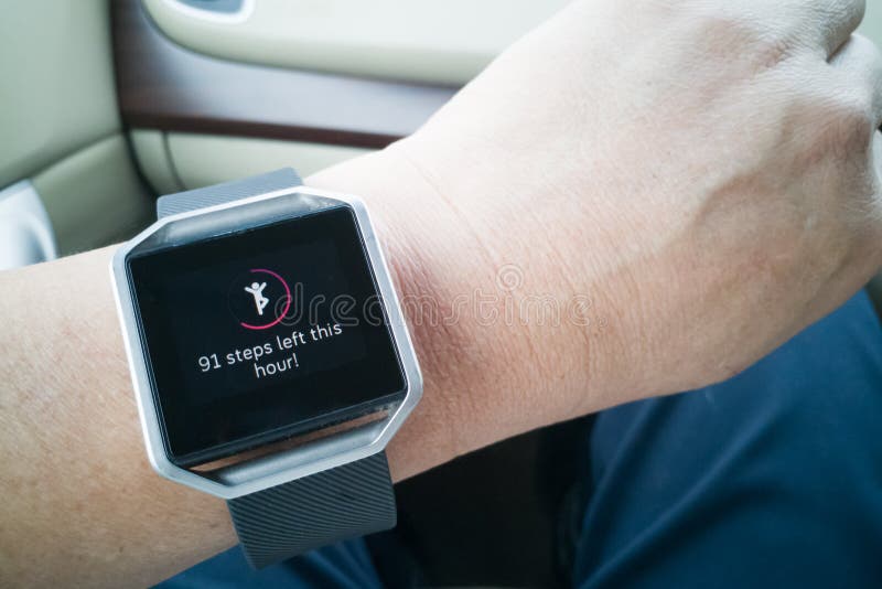 Perspective View Person Reading Watch with Steps and Heart Tracker ...