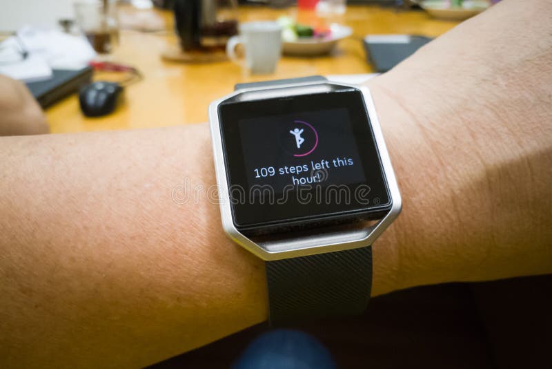 Perspective View Person Reading Watch with Steps and Heart Tracker ...