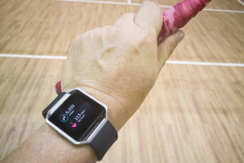 Perspective View Person Reading Watch with Steps and Heart Tracker ...