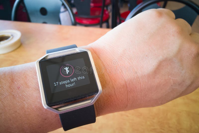 Perspective View Person Reading Watch with Steps and Heart Tracker ...