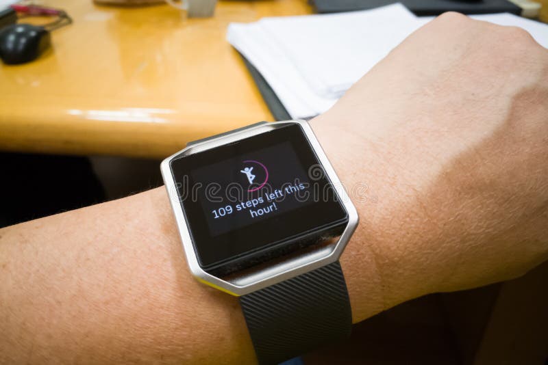 Perspective View Person Reading Watch with Steps and Heart Tracker ...