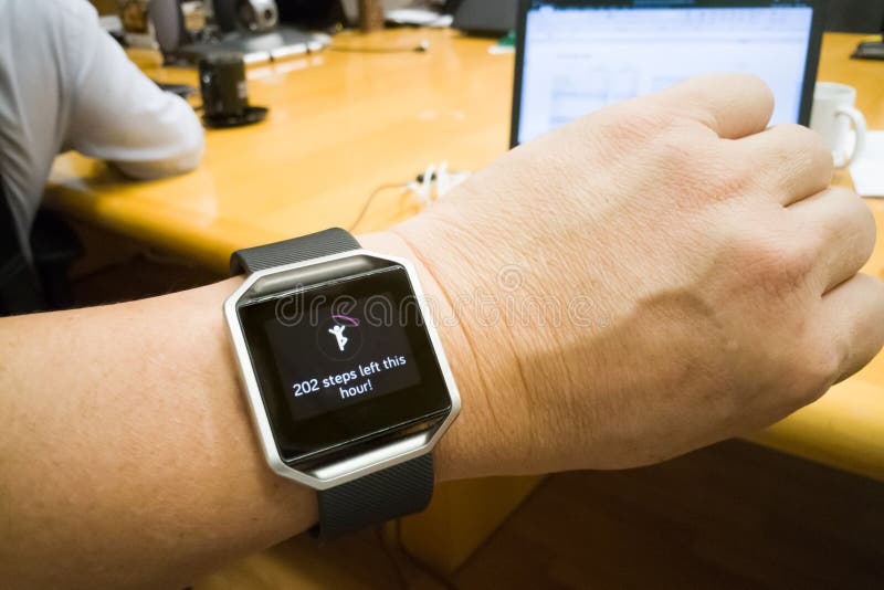 Perspective View Person Reading Watch with Steps and Heart Tracker ...