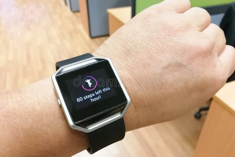 Perspective View Person Reading Watch with Steps and Heart Tracker in ...