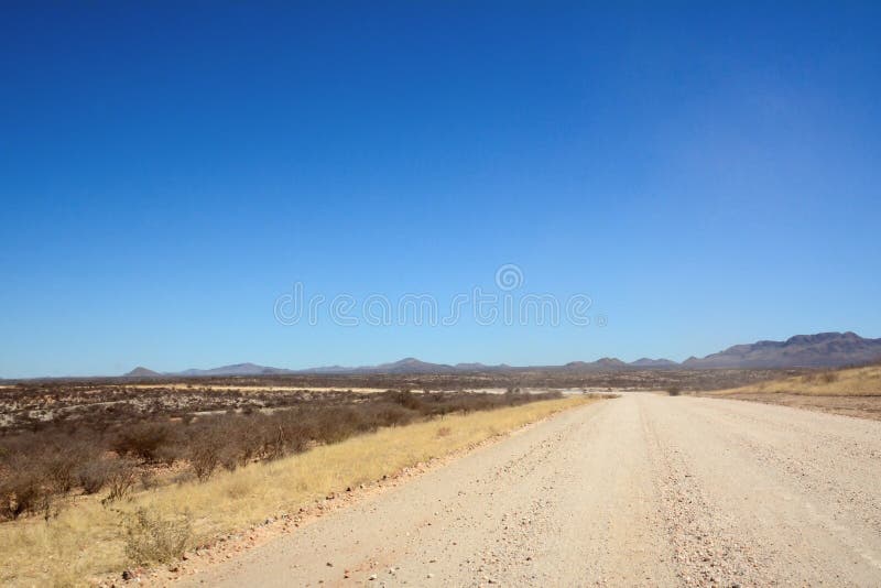 A Perspective View of a Road in a Desert Area between Small Hills Under ...