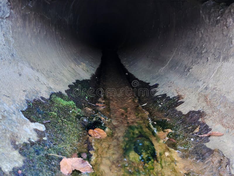 A Perspective View of a Sewer Pipe from Which Sewage Flows Stock Image ...