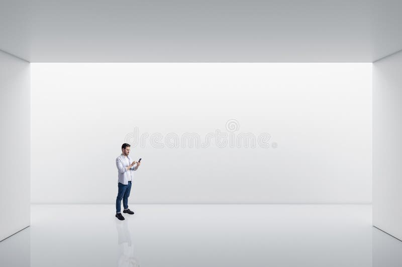 Perspective View on Young Man Using Smartphone in Empty Spacious Area ...
