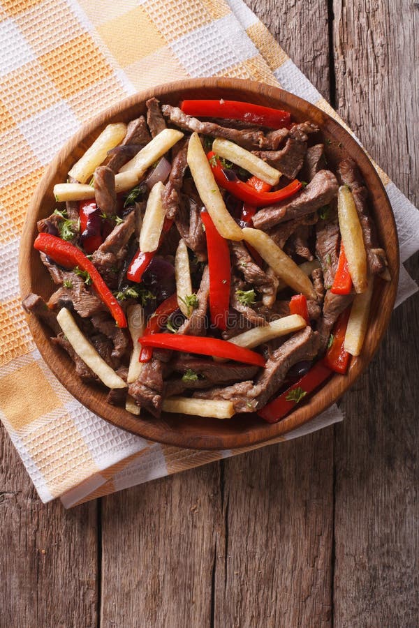 Peruvian Cuisine: Lomo Saltado on a Plate. Vertical Top View Stock ...