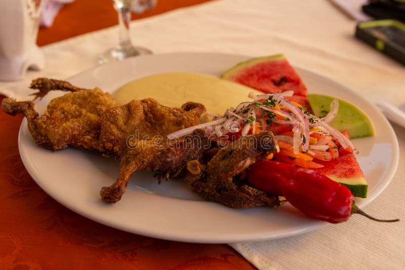 Peruvian Cuy Served on a Plate Stock Photo - Image of salad, chili ...
