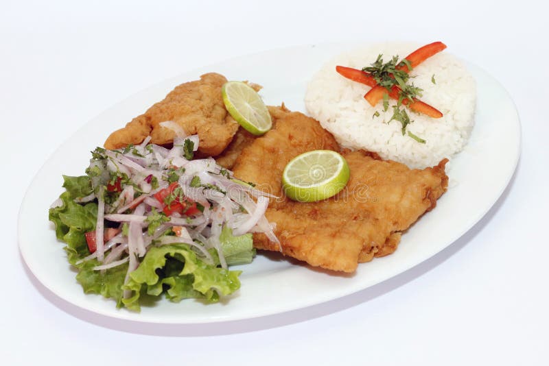 Peruvian Dish: Fried Fish with Salad, Lemon and Rice. Stock Photo ...