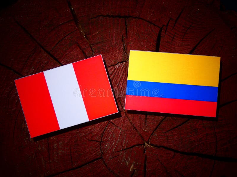 Peruvian Flag with Colombian Flag on a Tree Stump Isolated Stock ...