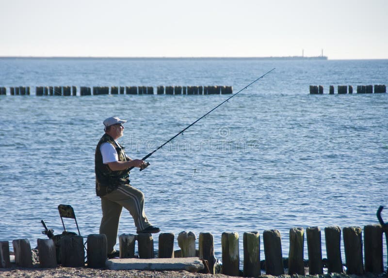Pesca en mar imagen de archivo. Imagen de azul, hombre - 5213139