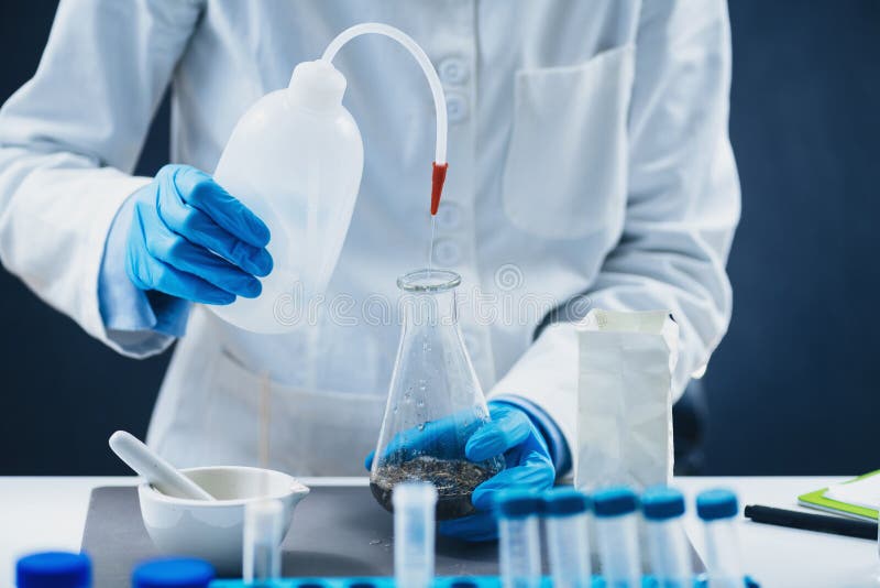 Pesticides in Tea. Quality Control Inspector Working with Herbal Tea ...