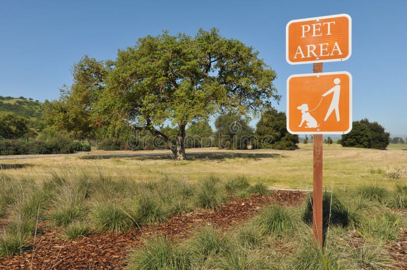 Pet Area Sign in Field Near a Tree Stock Image - Image of grass, symbol ...