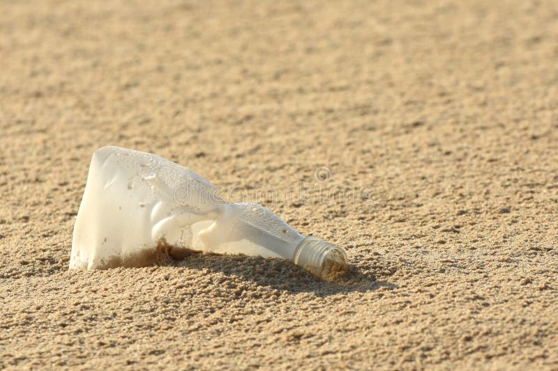 PET Bottle on a Sandy Beach. the Problem of Plastic Pollution of the ...
