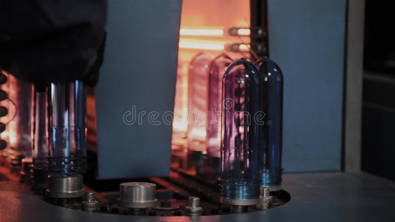 PET Preforms Move on Heating Oven Line in Fast Speed. Plastic Bottles ...