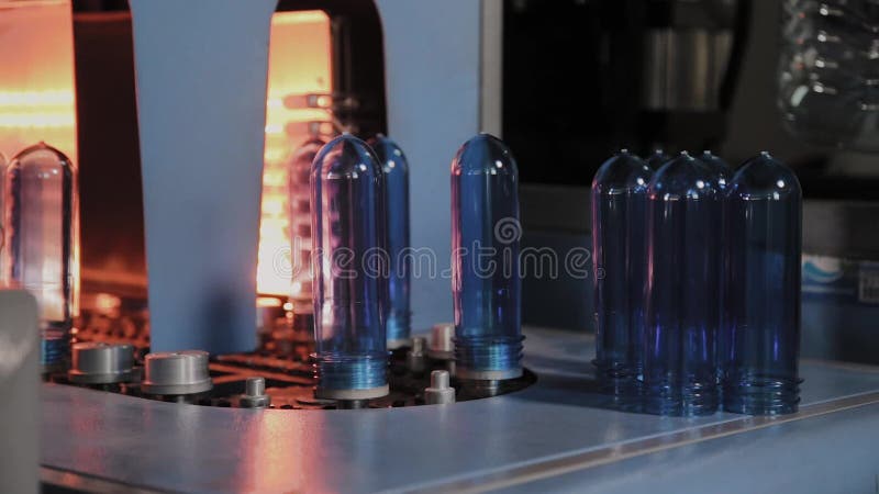PET Preforms Move on Heating Oven Line in Fast Speed. Plastic Bottles ...