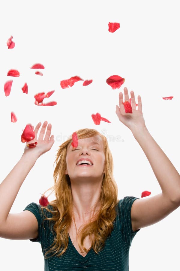 Petals falling on a woman stock image. Image of creative - 62561409